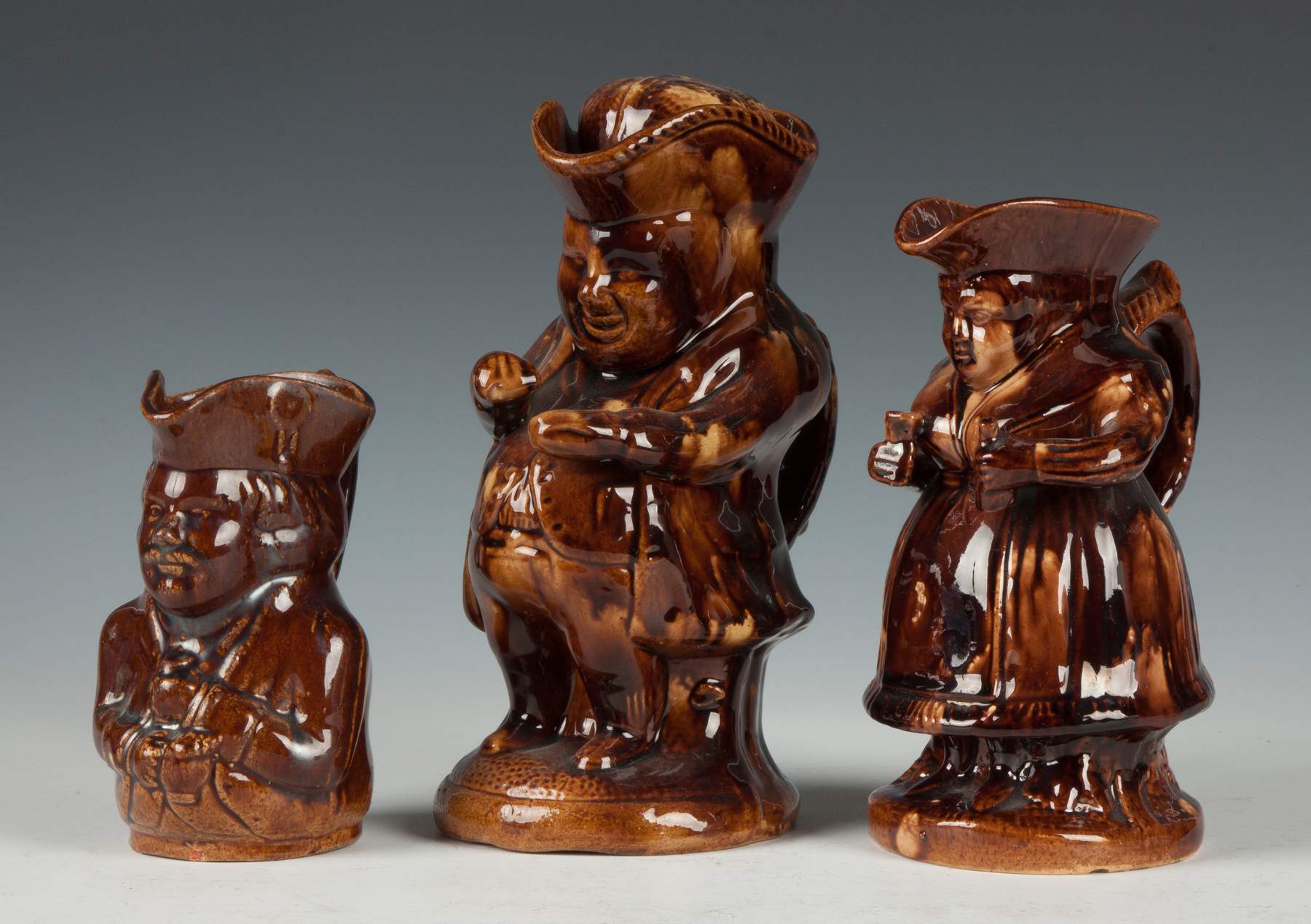 Three Glazed Toby Pitchers | Cottone Auctions