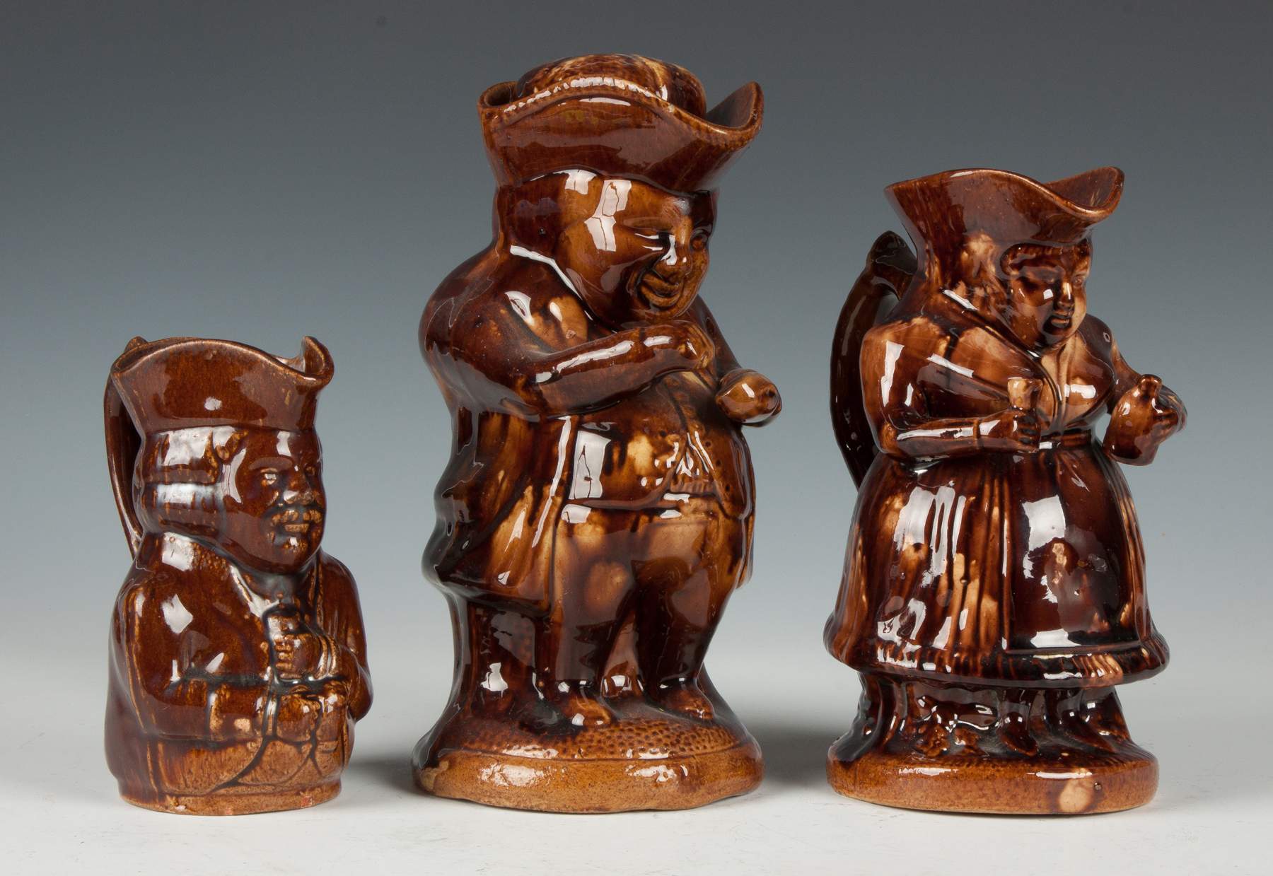 Three Glazed Toby Pitchers | Cottone Auctions