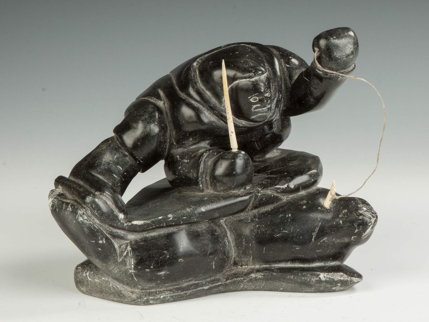 Inuit Carved Soapstone of a Seal Hunter | Cottone Auctions