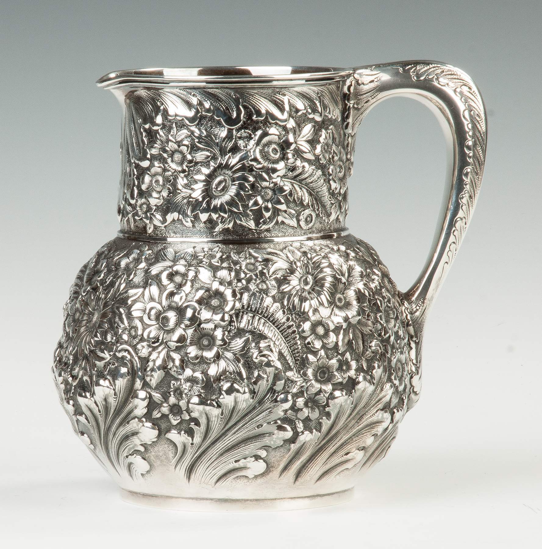 Fine Tiffany and Co. Sterling Silver Repousse Pitcher | Cottone Auctions