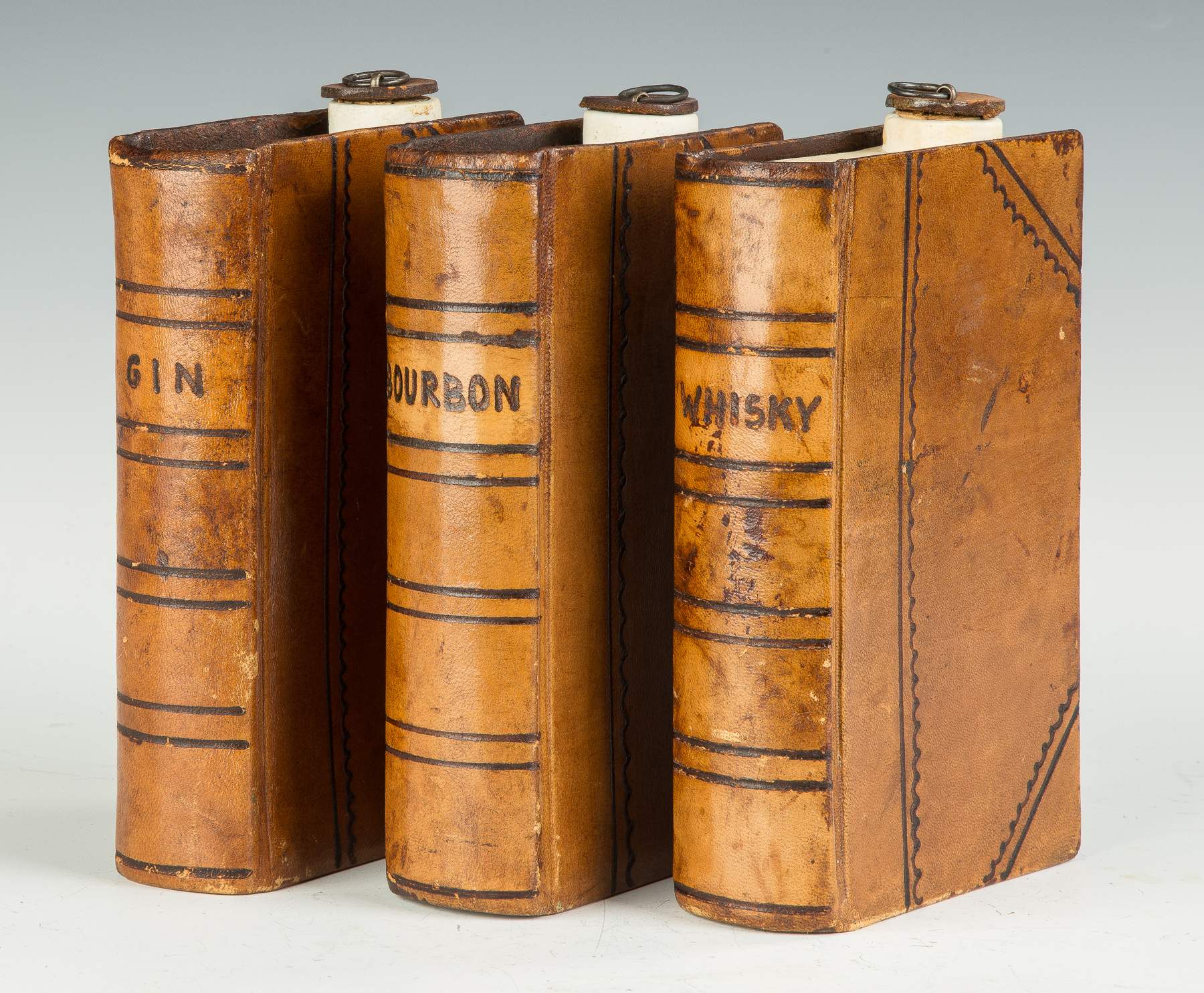 Leather Bound and Ceramic Book Flasks | Cottone Auctions