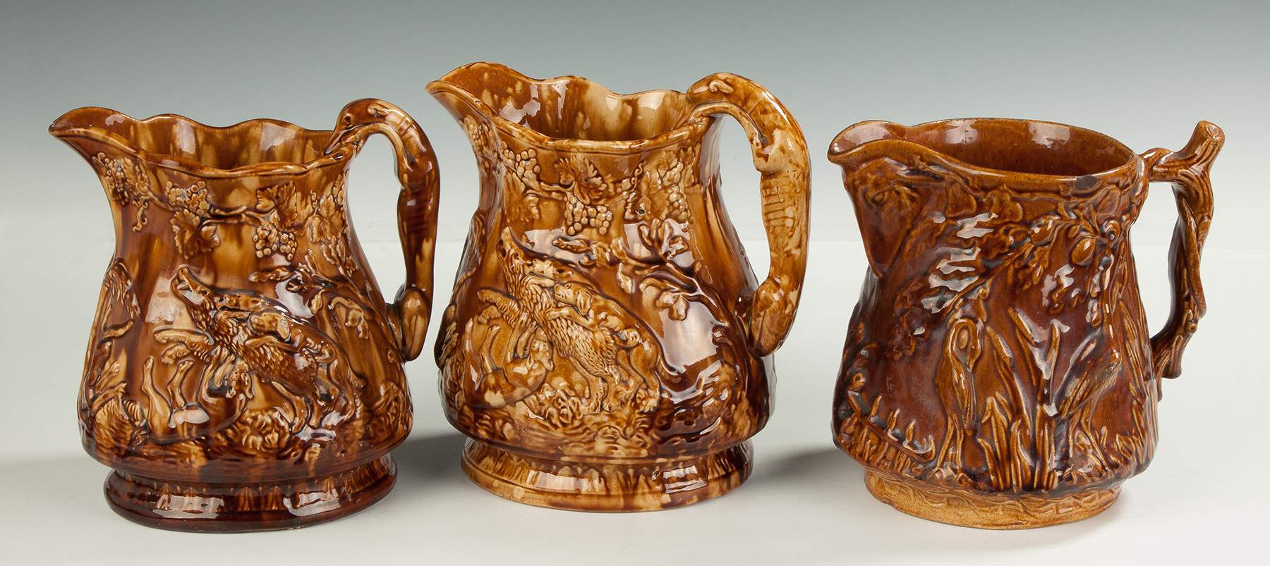Three Rockingham Pitchers | Cottone Auctions