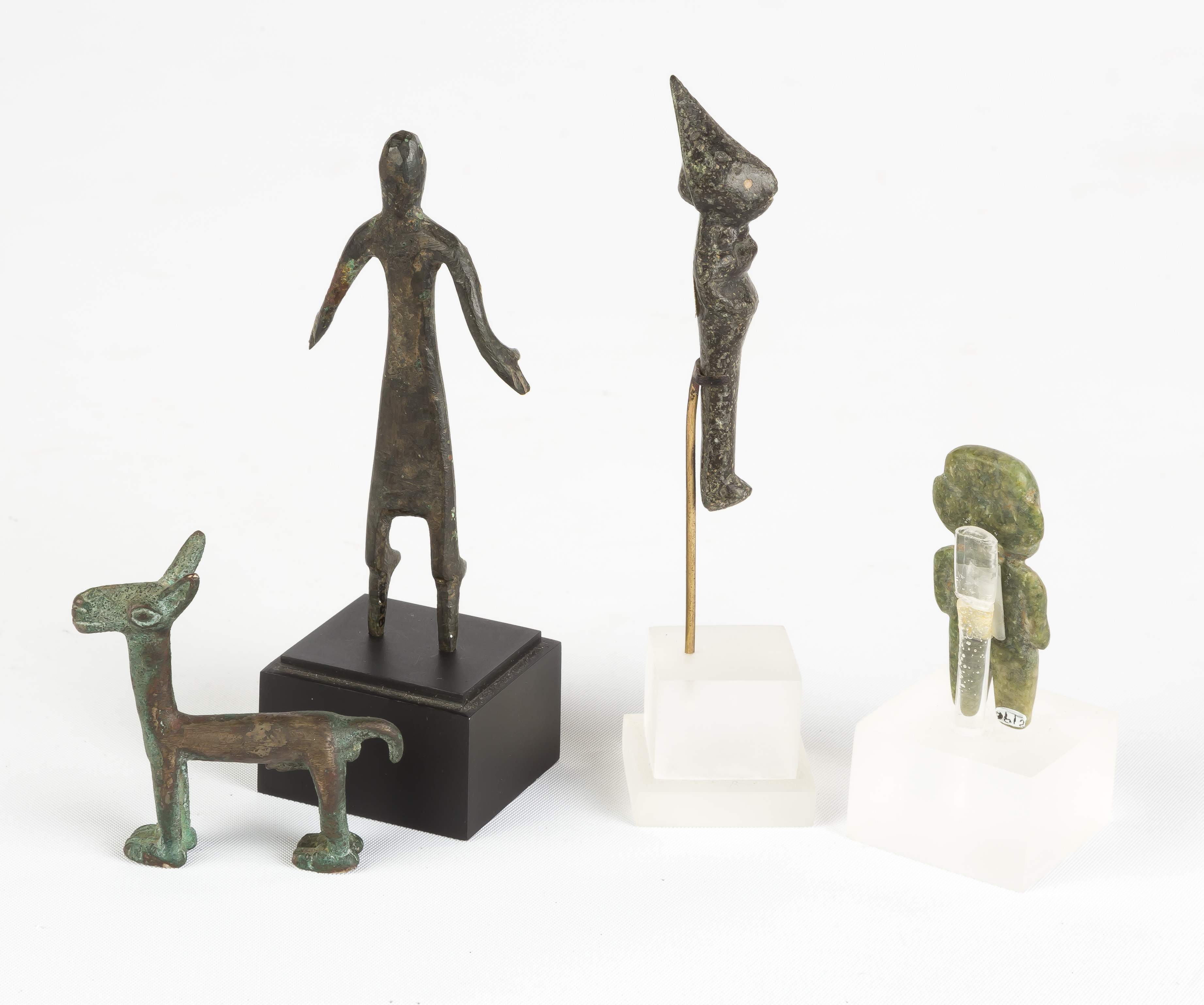 Four Early Metal and Stone Figures | Cottone Auctions