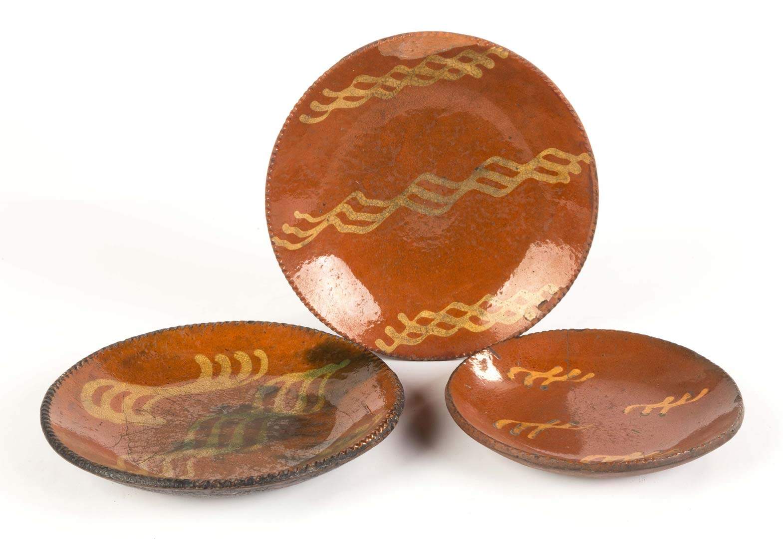 Three Decorated Redware Plates | Cottone Auctions