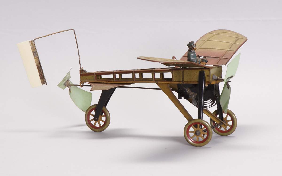 Late 19th Cent. Tin Clockwork Airplane | Cottone Auctions