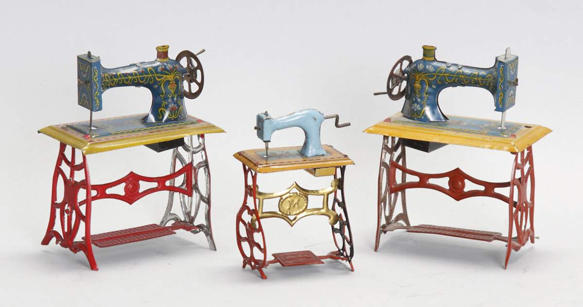 3 German Lithographed Tin Sewing Machine Penny Toys | Cottone Auctions