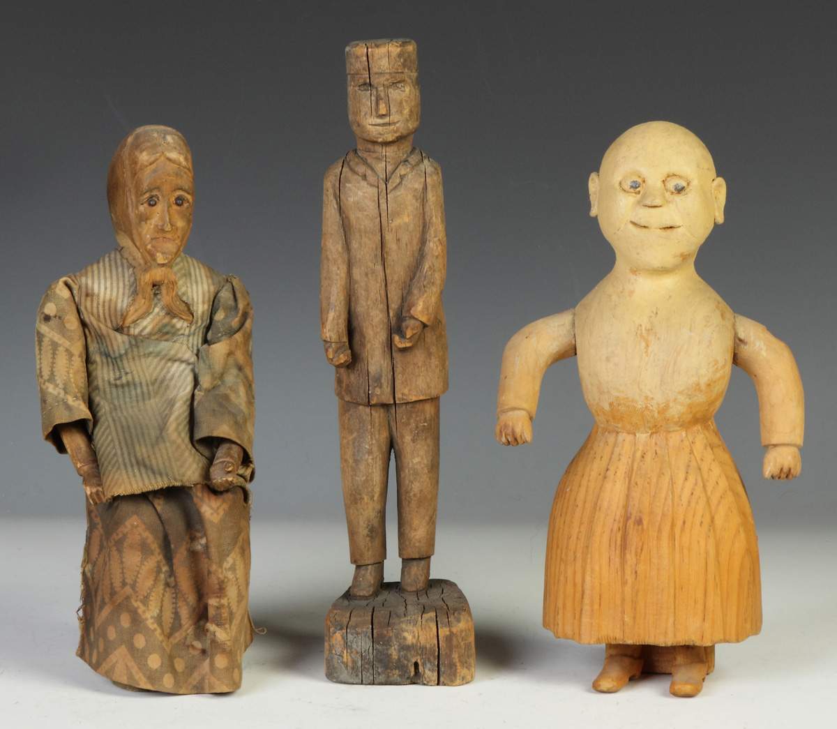 Three Carved Primitive Figures | Cottone Auctions