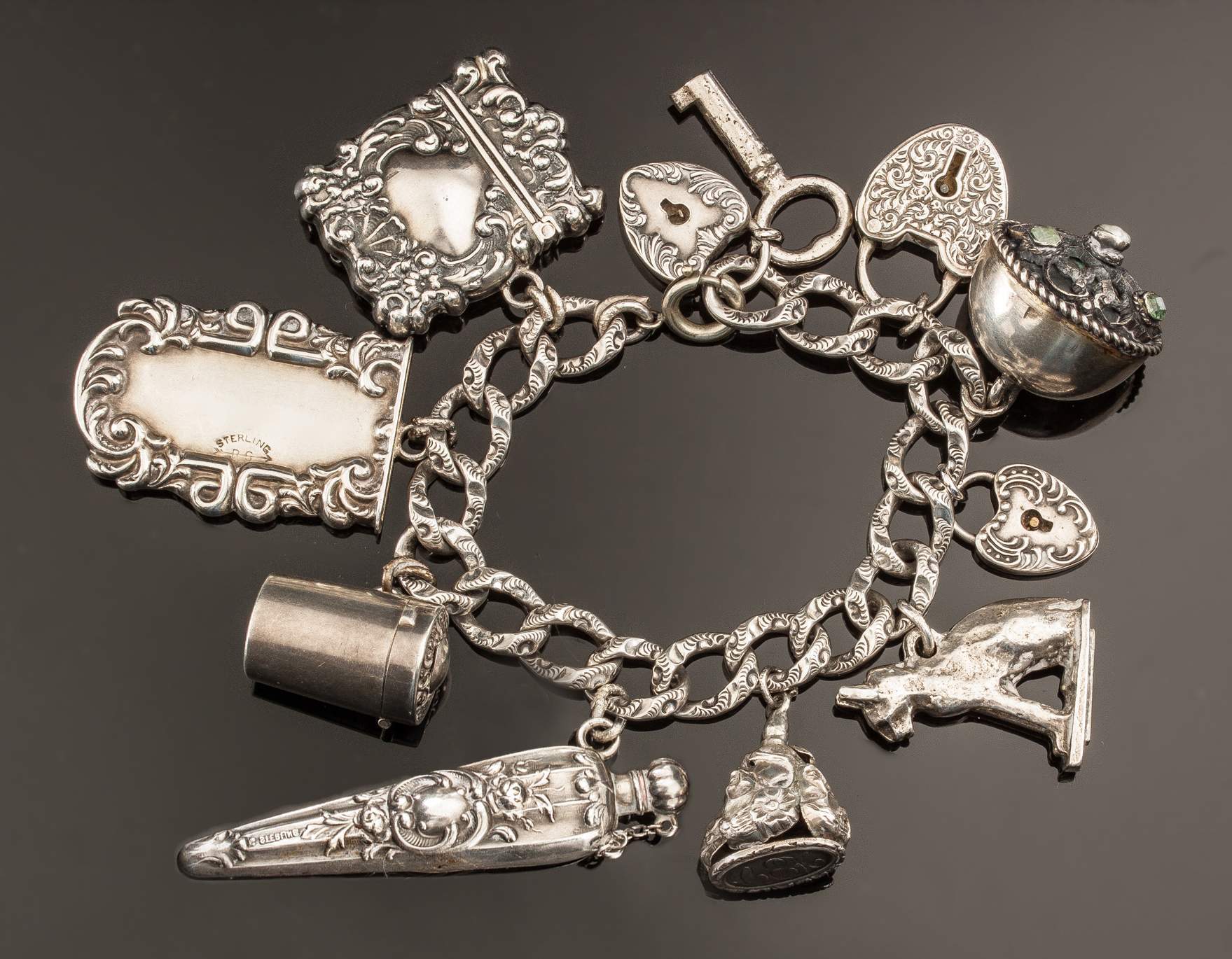 Sterling Silver Charm Bracelet | Cottone Auctions