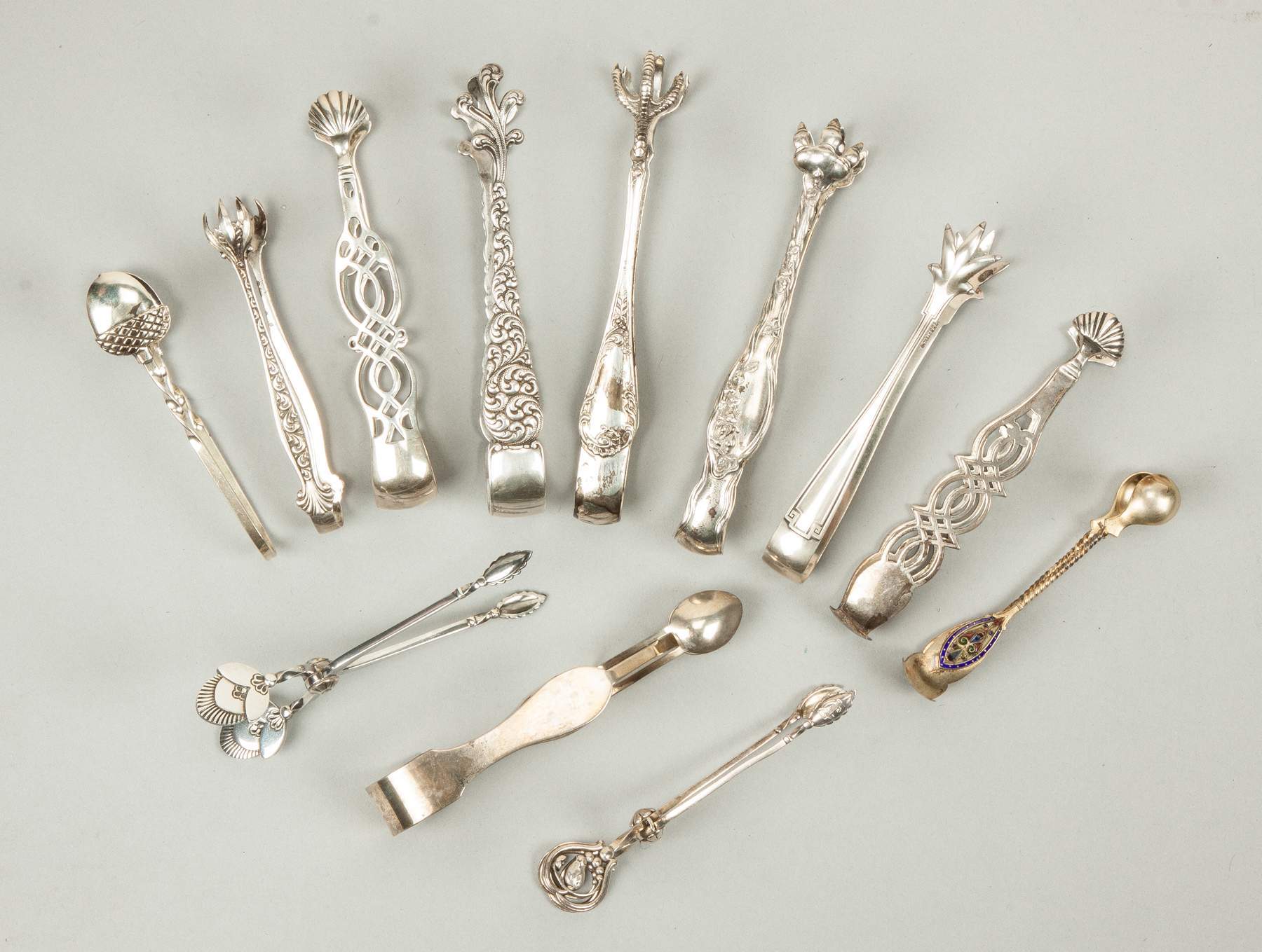 Twelve Various Sterling Silver Tongs | Cottone Auctions